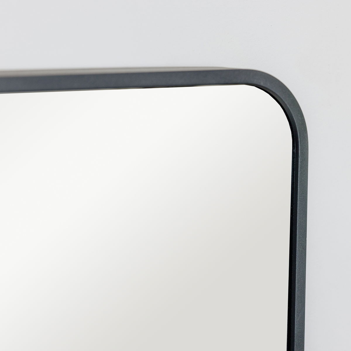 Black Curved Framed Wall Mirror 100cm x 50cm | Melody Maison